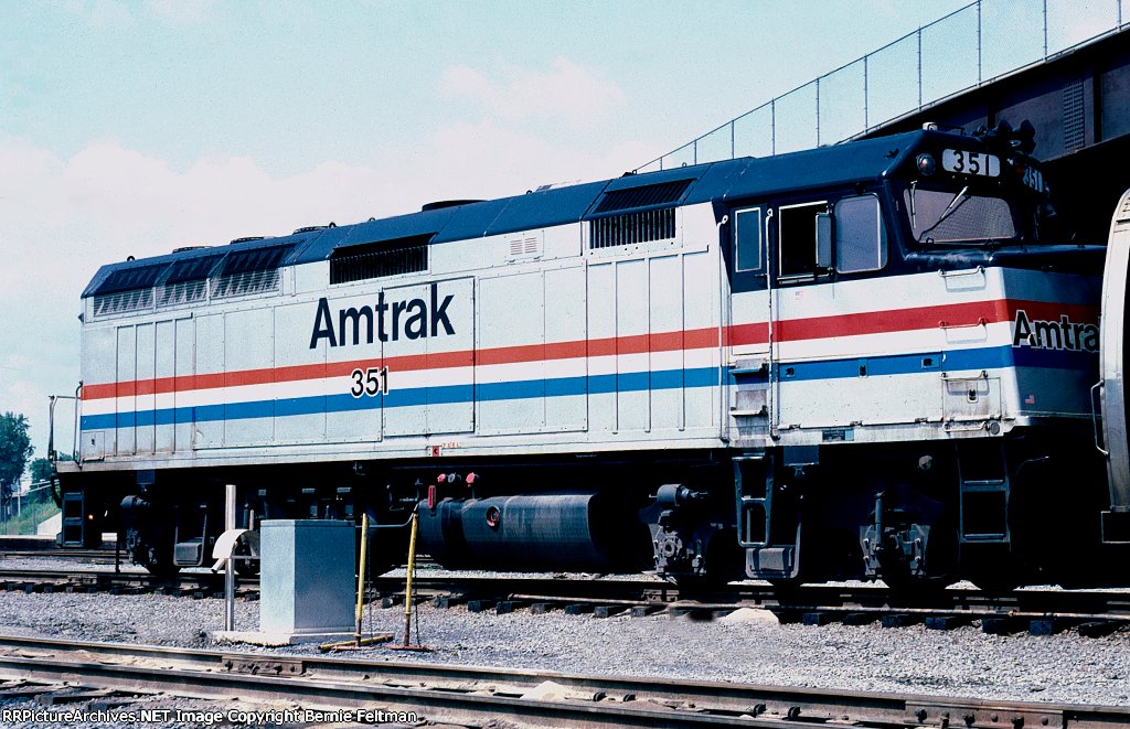 Amtrak F40PH #351, coupled to a cut of passenger cars and providing HEP power,
